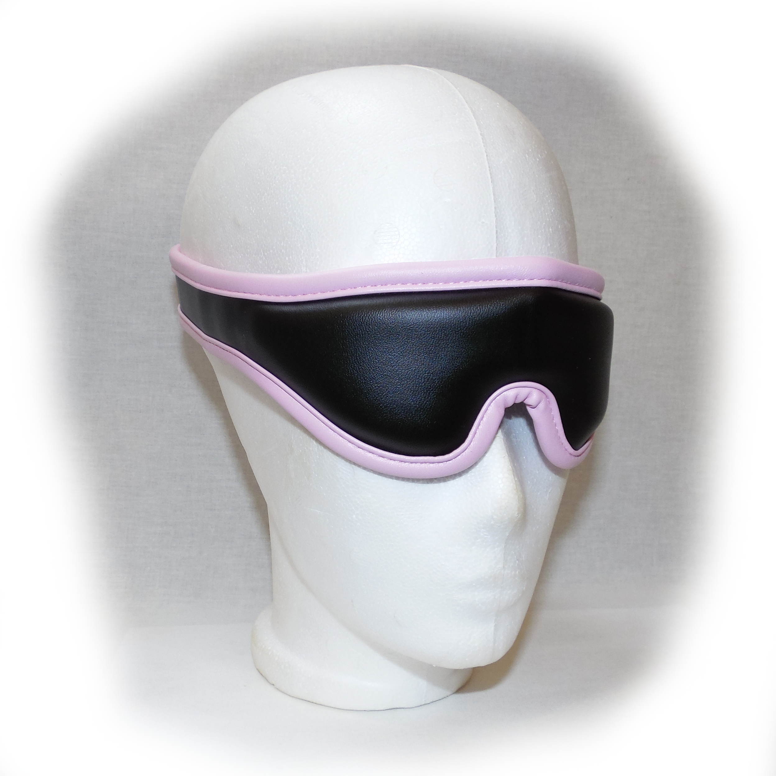 Eye mask with pink border and Velcro fastener